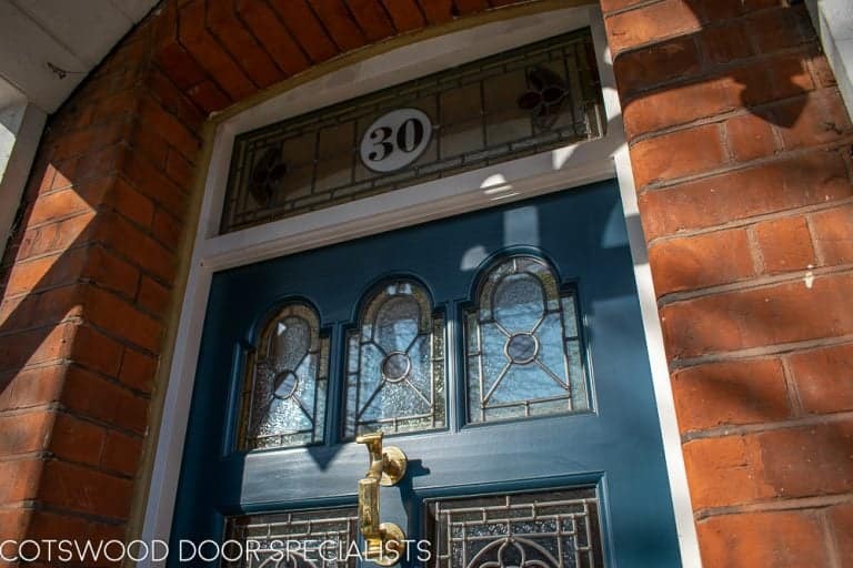 Five light door painted blue with stained glass