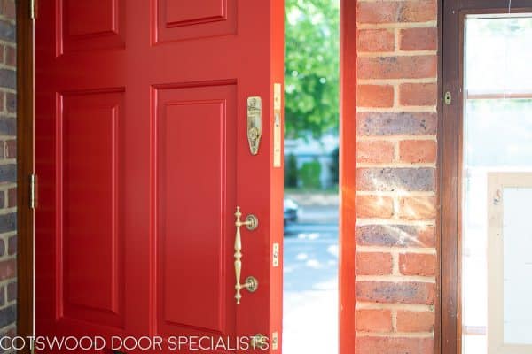 Five panel front door and arched frame
