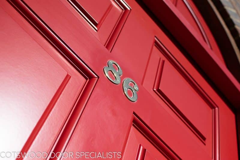 Five panel front door and arched frame